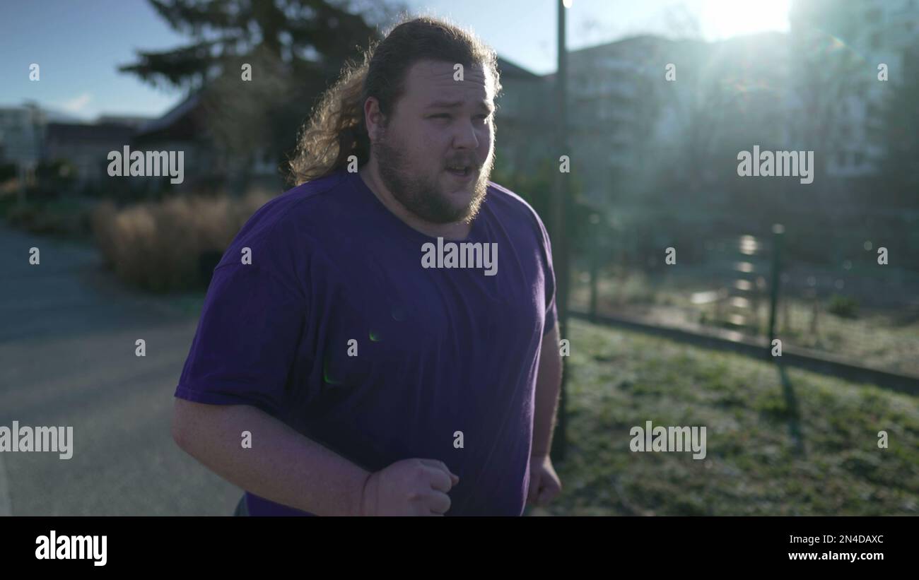 Overweight man exhausted exercising hi-res stock photography and images ...