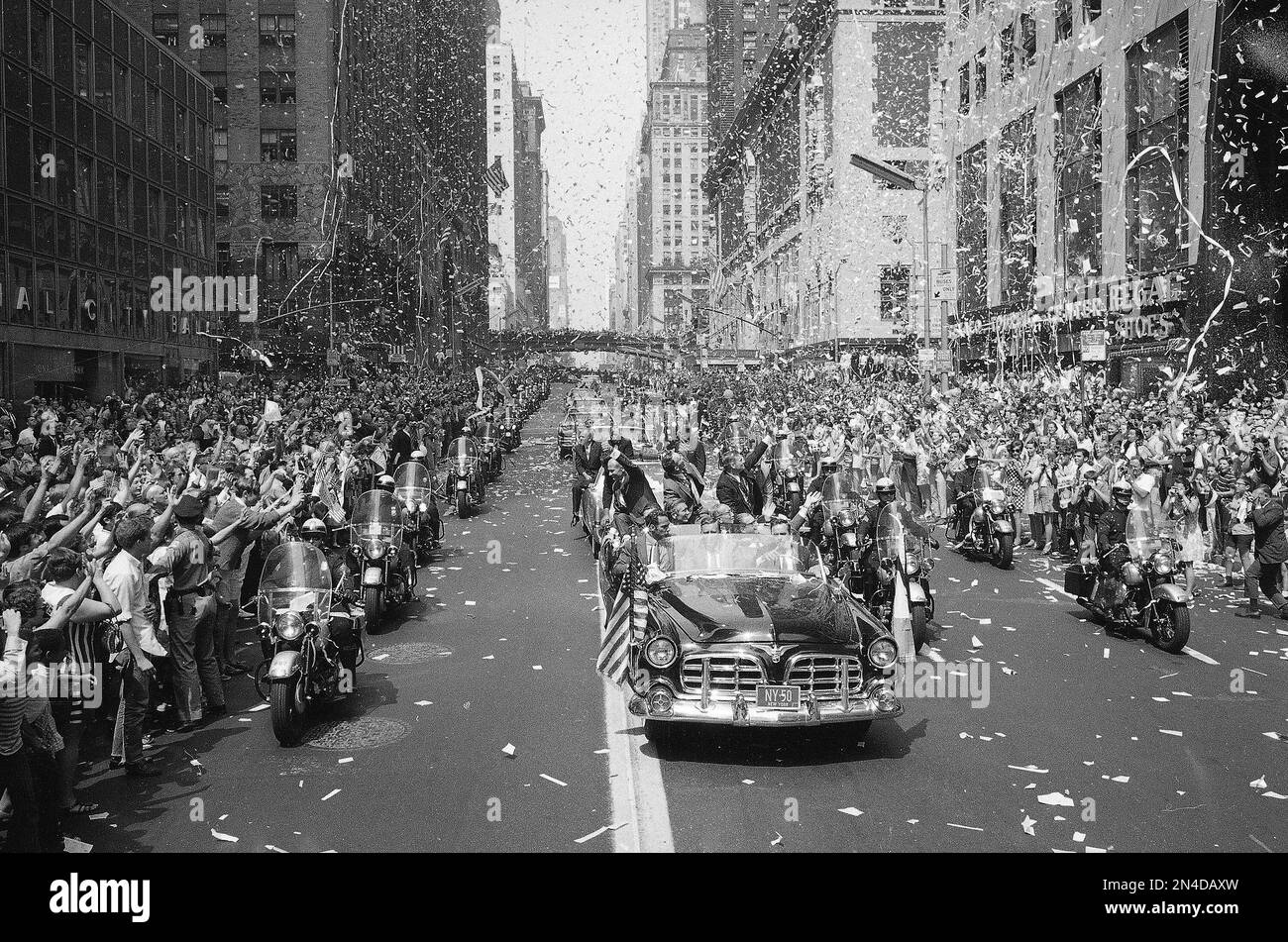 FILE - In this Aug. 13, 1969 file photo, New Yorkers line 42nd Street ...