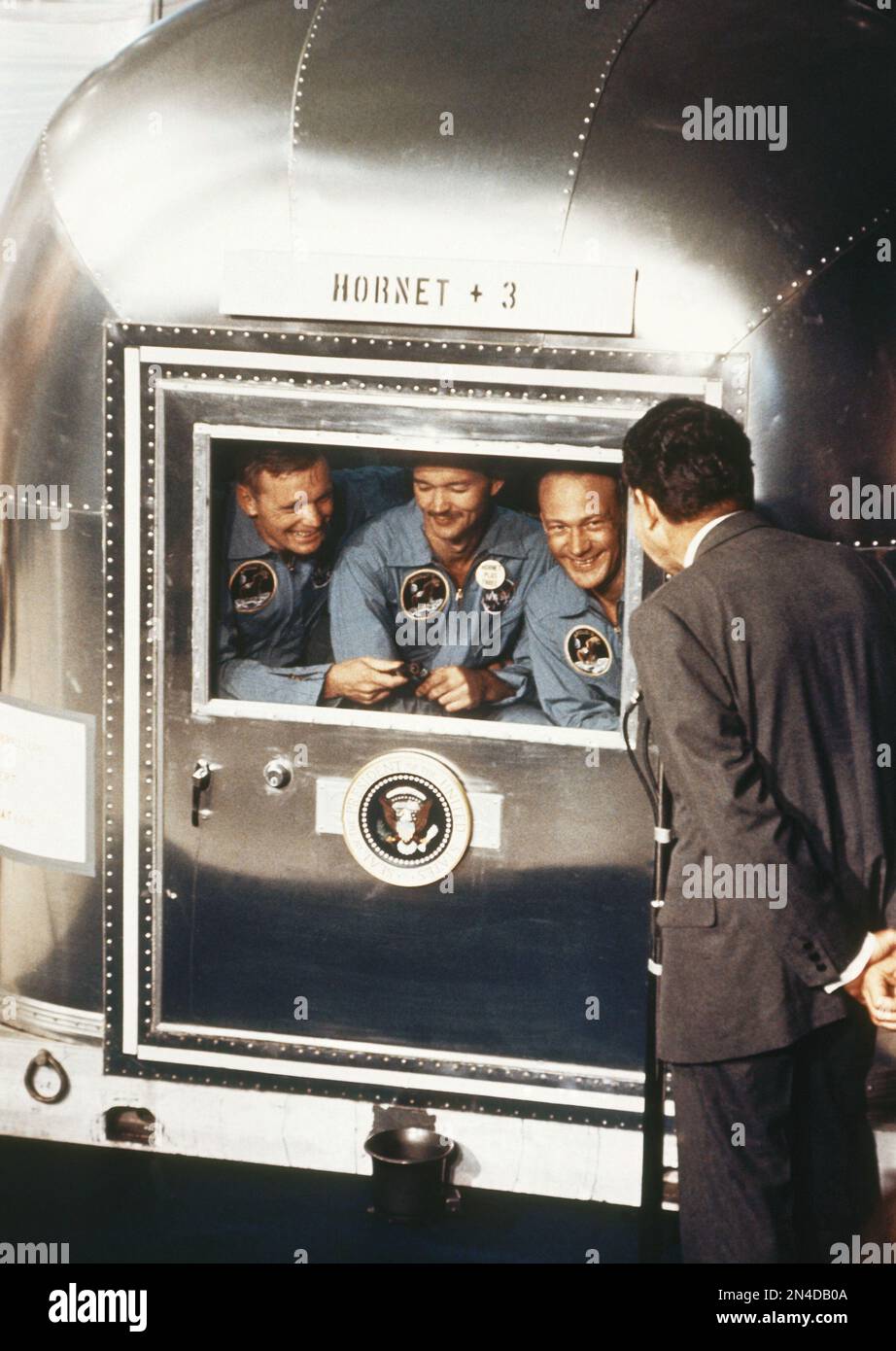 FILE - In this July 24, 1969 file photo, President Richard Nixon, right ...