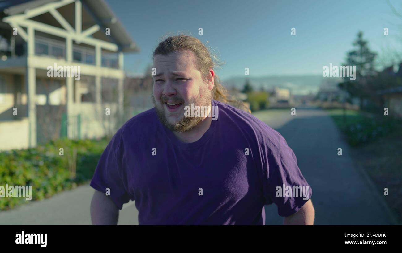 One hopeful overweight man standing hi-res stock photography and images ...