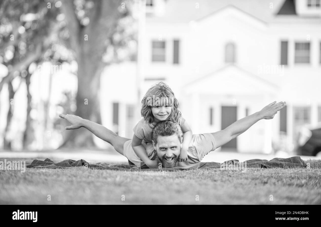 happy dad having fun with kid relax together on green park grass, best ...