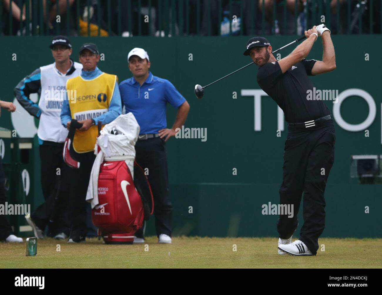 Dustin Johnson of the US plays a shot from the 1st tee during the third ...