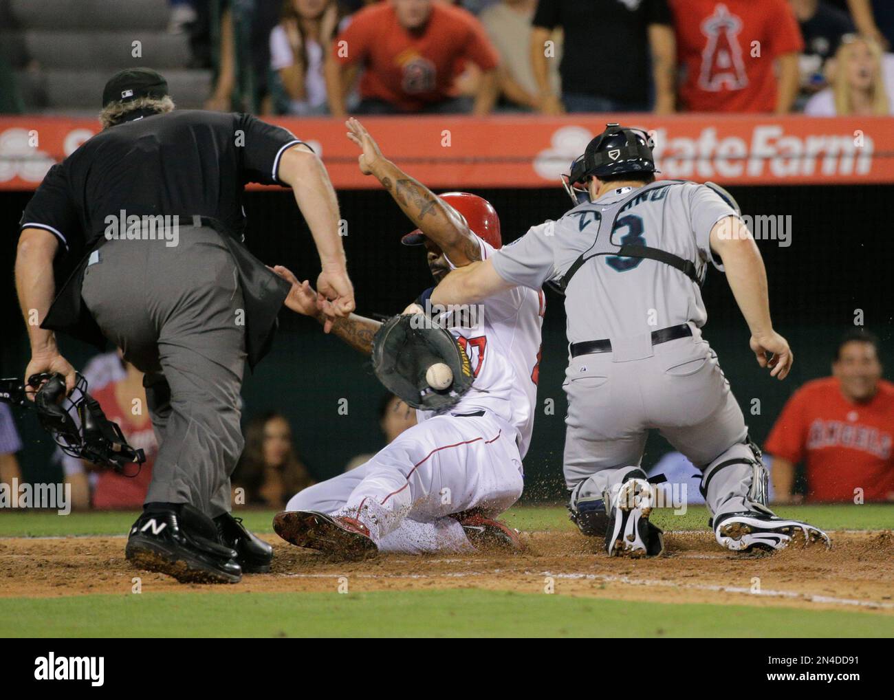 Los Angeles Angels' Howie Kendrick, center, scores on a double by David ...
