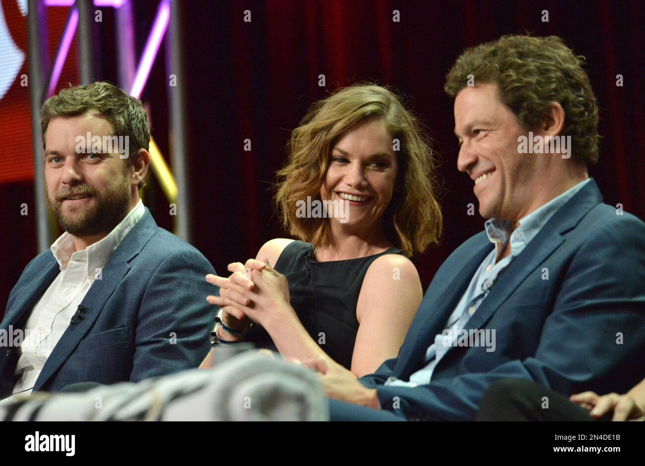 From left, Joshua Jackson, Ruth Wilson and Dominic West speak on stage ...