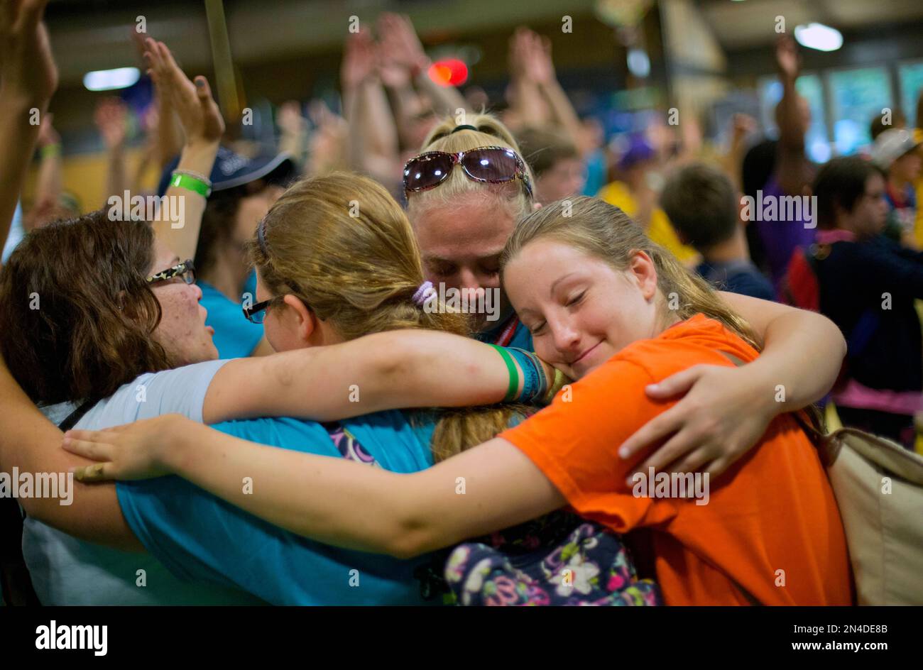 Brylee Russell, 13, right, of Burleson, Texas, right, embraces fellow ...