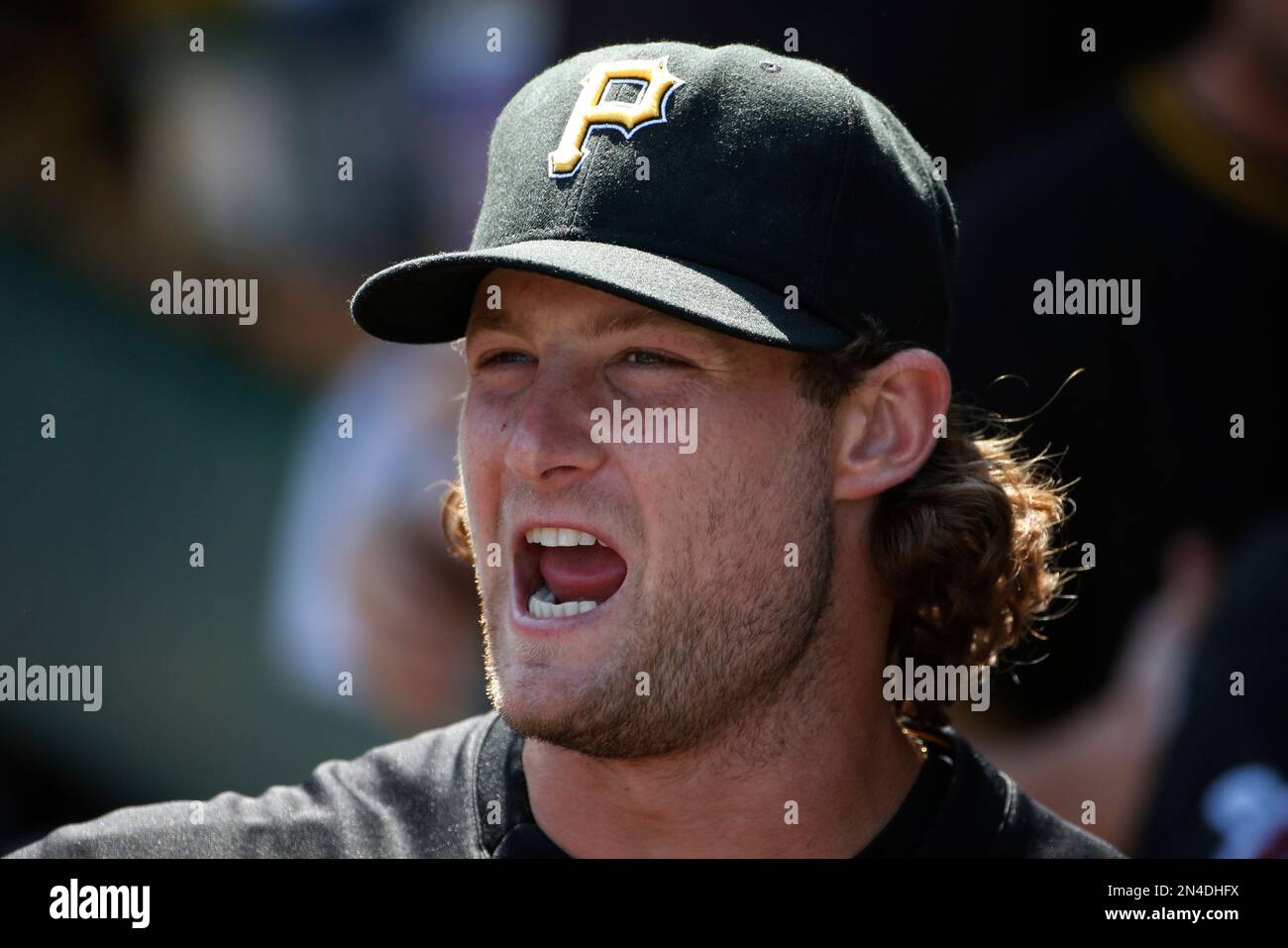 Pittsburgh Pirates' Gerrit Cole stands in the dugout before a baseball ...