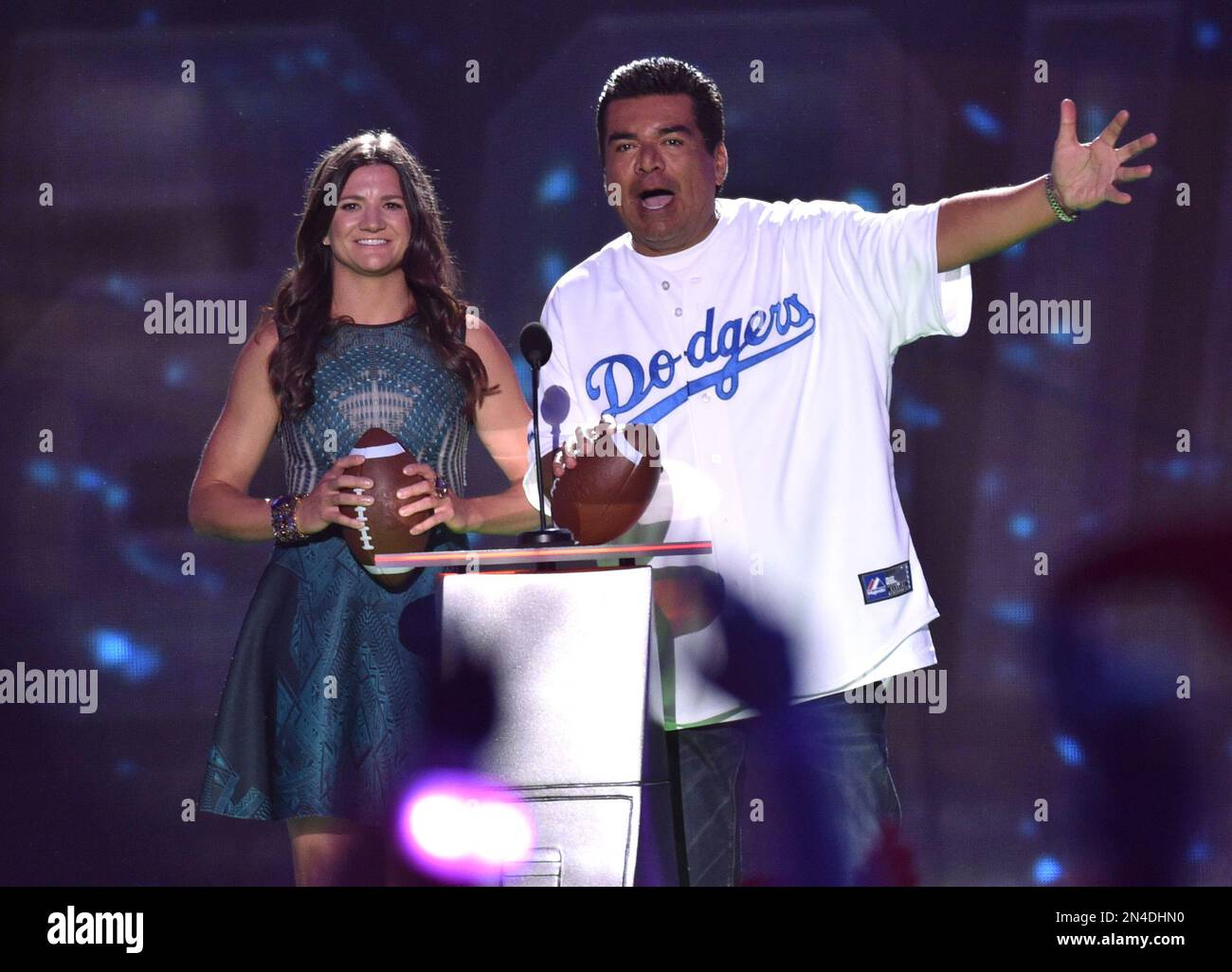 Kelly Clark, left, and George Lopez present the favorite catch award at ...