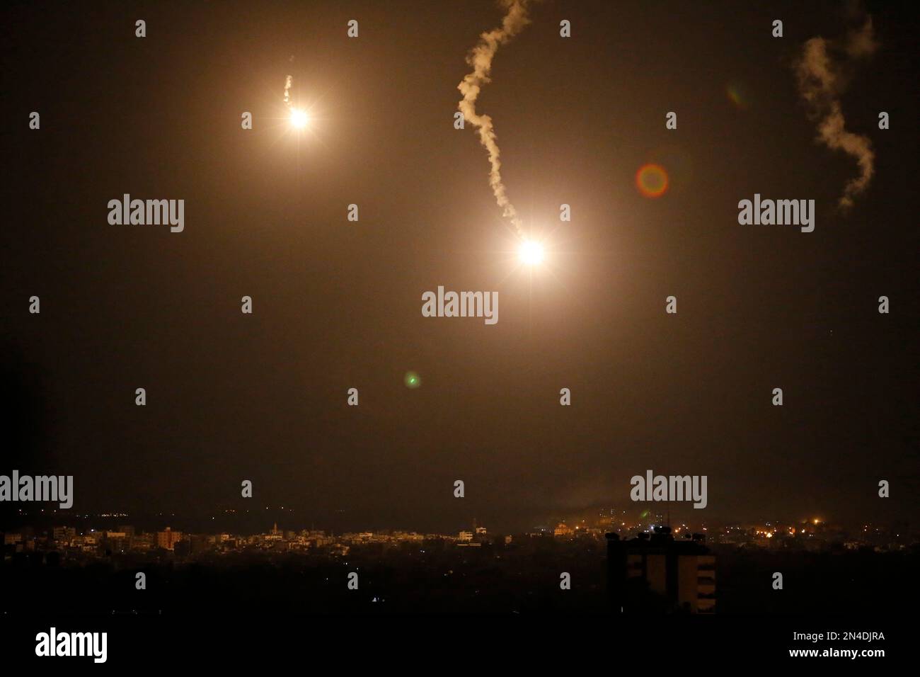 Flares light the sky over Gaza City, in the northern Gaza Strip ...