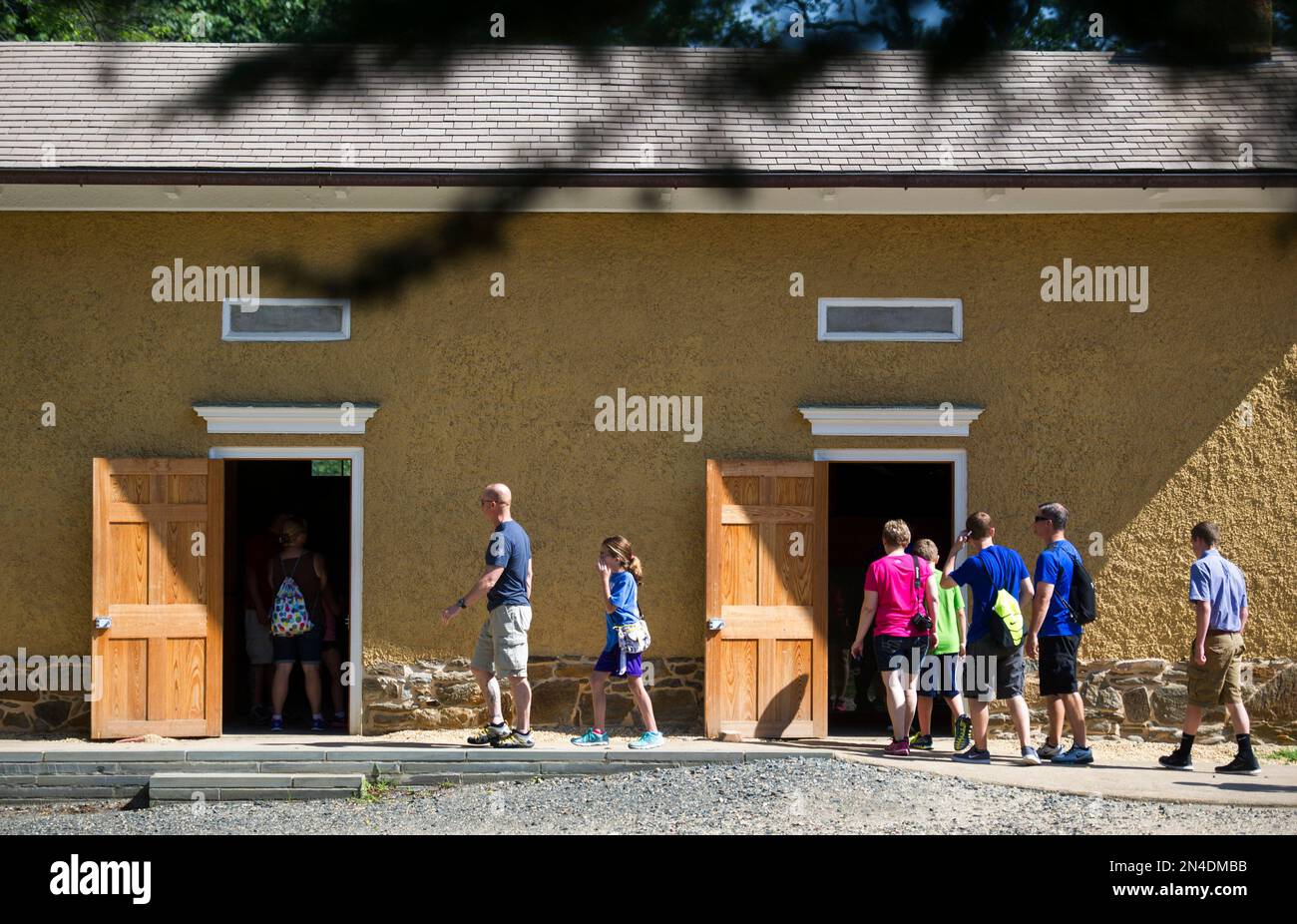 Visitors tour the slave quarters of the historic Arlington House at ...