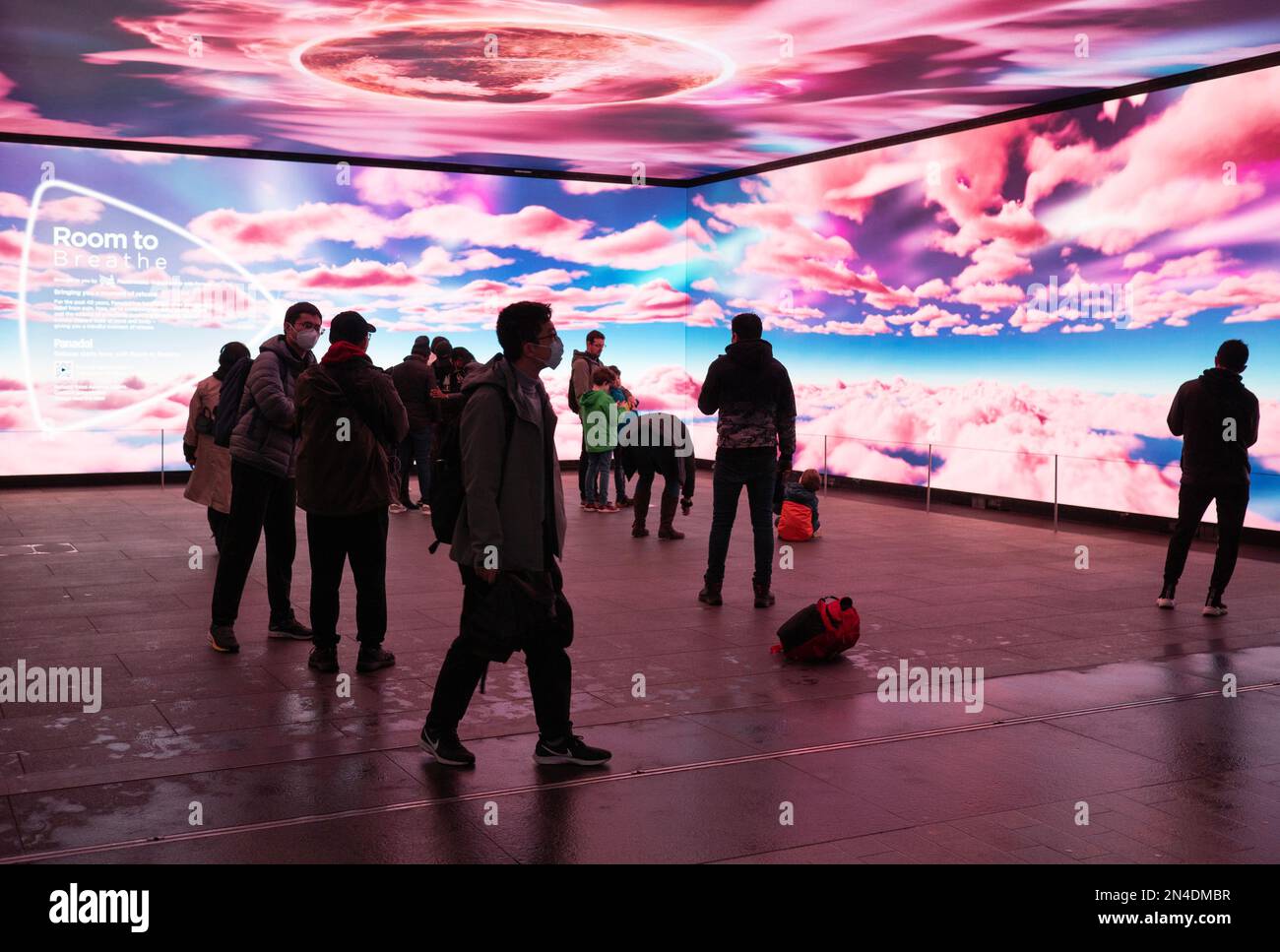 The now building. Members of the public look at huge screens ...