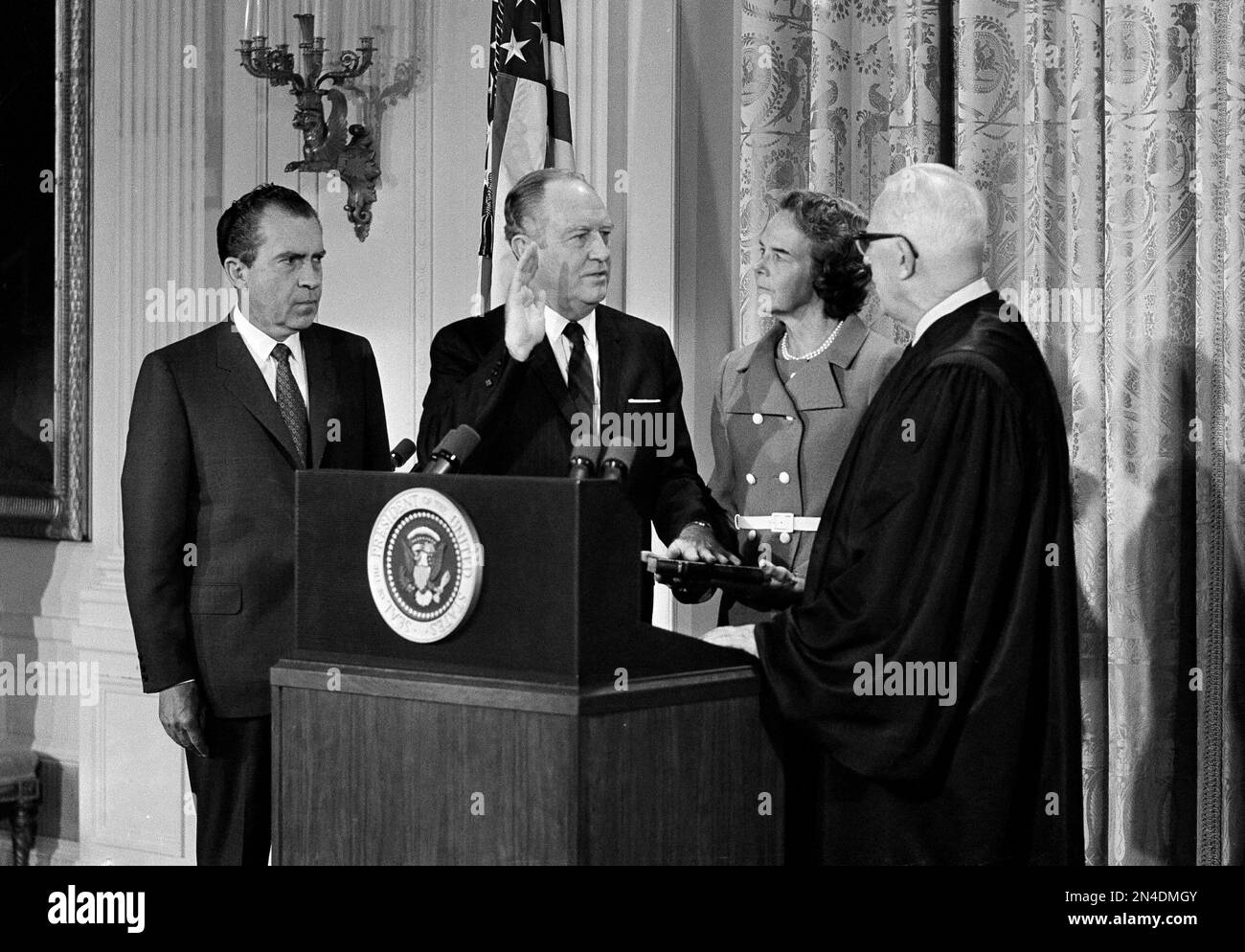 Secretary of State William P. Rogers takes the oath of office from ...
