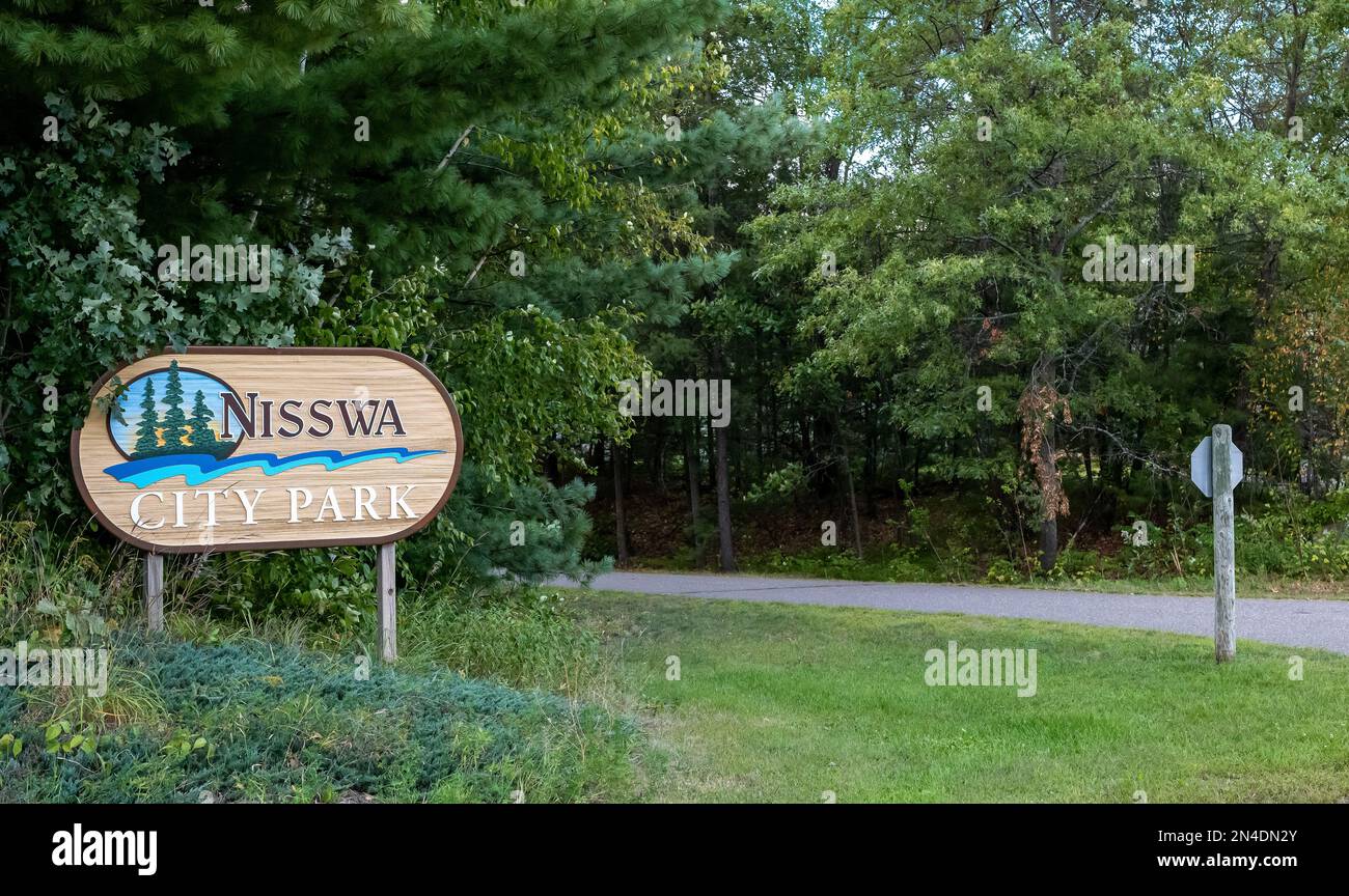 NISSWA, MN – 20220905: Wooden sign along a paved bicycle and snowmobile ...