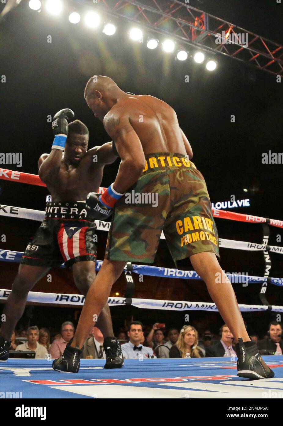 Yuniel Dorticos, right, and Edison Miranda fight during a boxing match ...