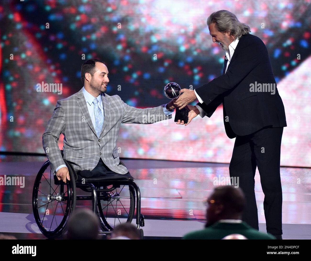Olympic sledge hockey player Josh Sweeney accepts the Pat Tillman award ...