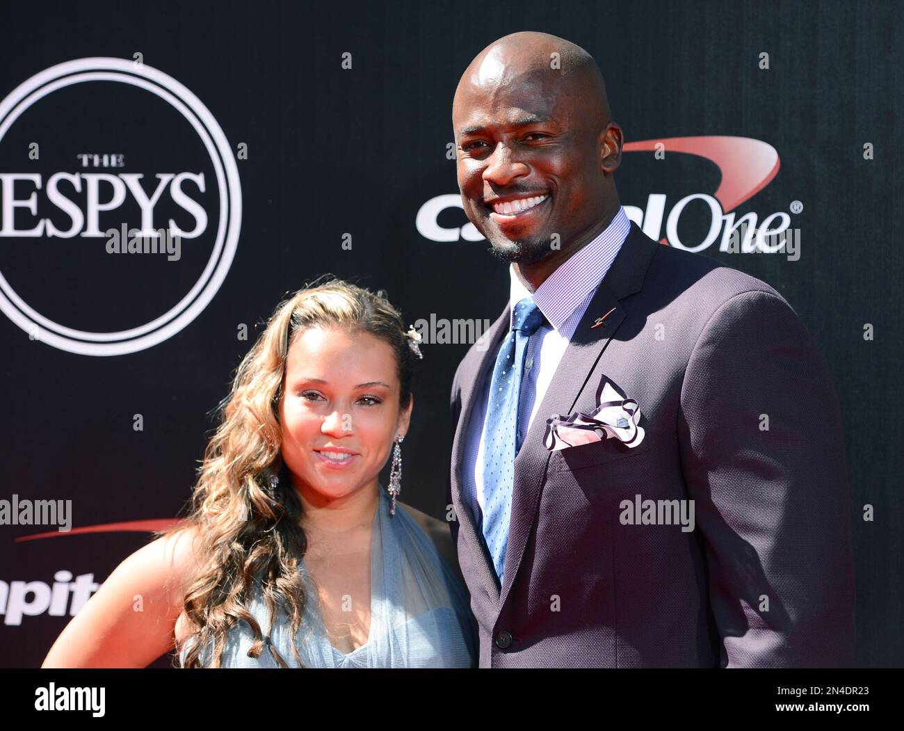 Former NFL player, right, Akbar Gbaja-Biamila, and wife Eileen Gbaja ...