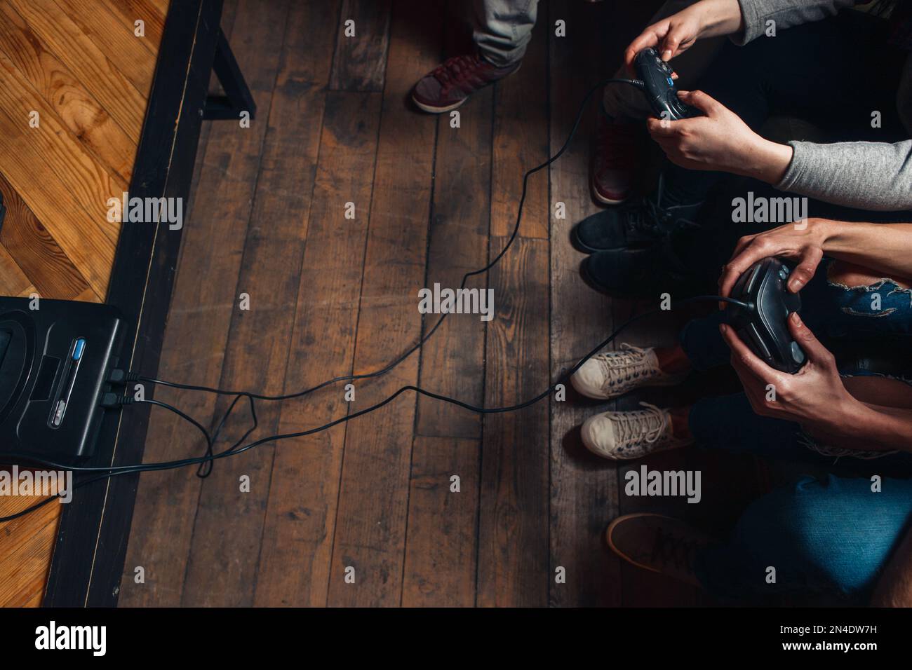 Group of unrecognizable people play video game Stock Photo - Alamy