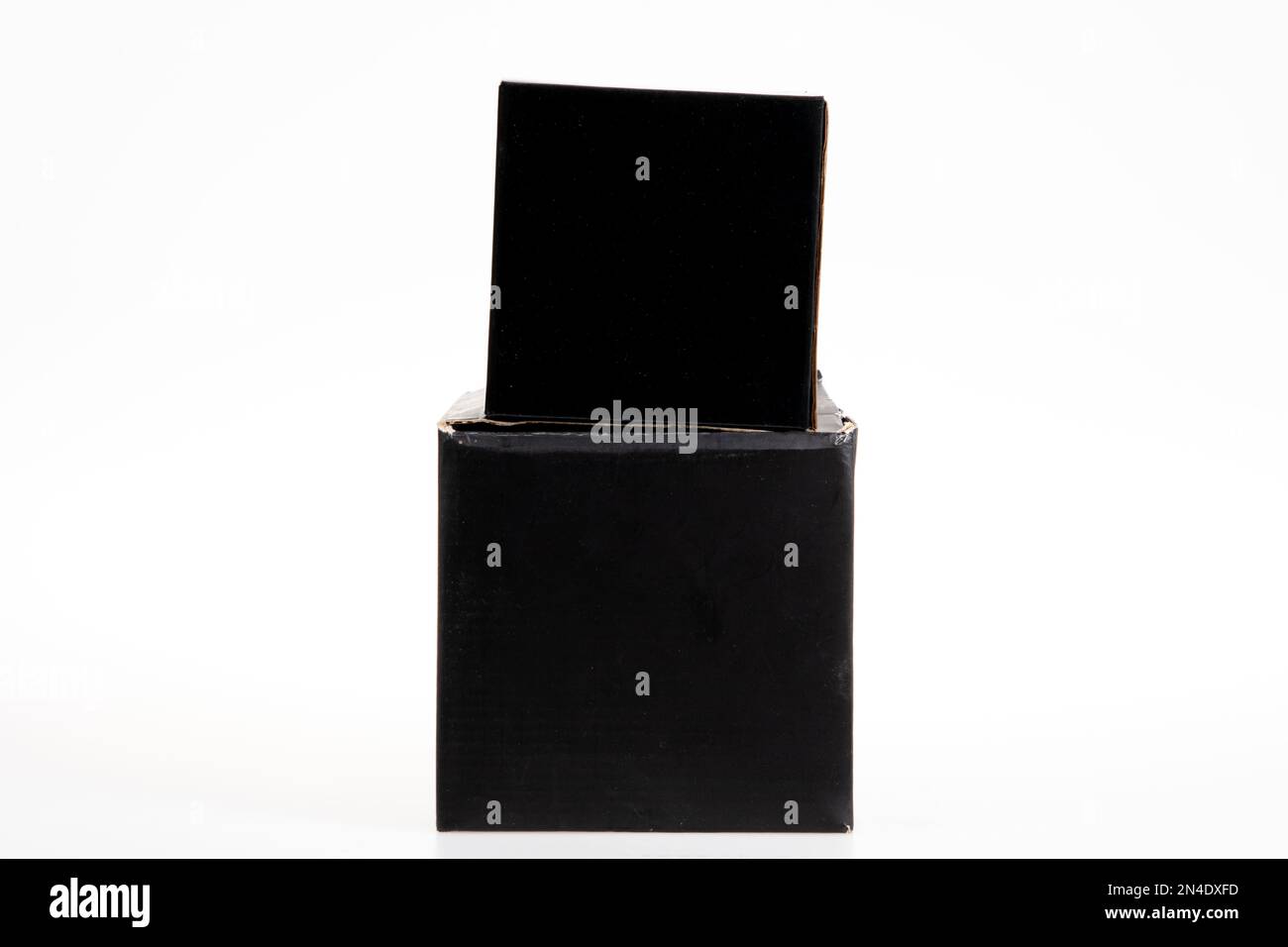 two black cardboard boxes on white background Stock Photo - Alamy