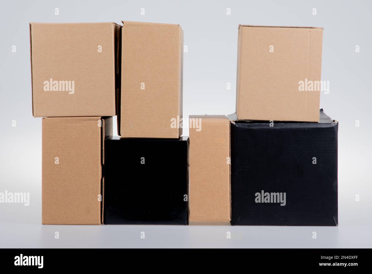 piles of cardboard boxes carton black and brown parcel on grey white ...