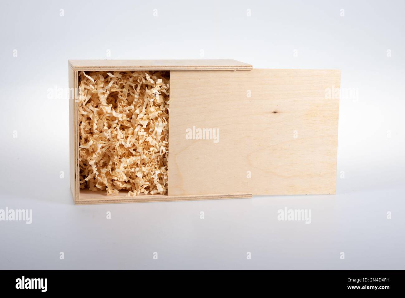 Wooden square box pine with closed sliding lid on white grey background ...