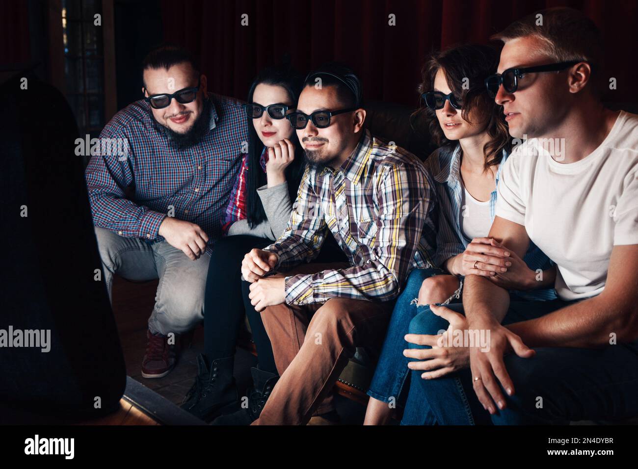 Group of youth watching new movie Stock Photo - Alamy