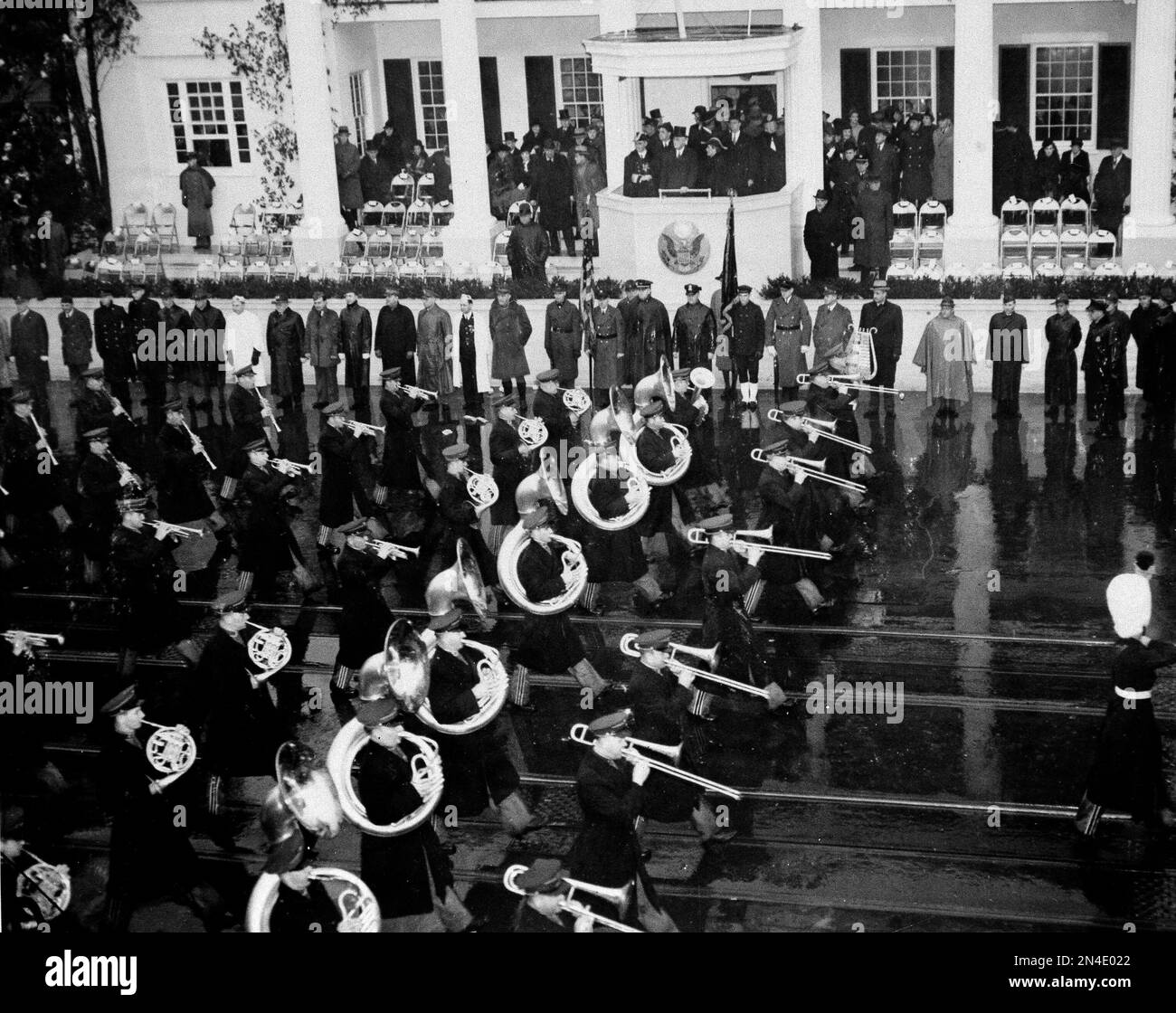 President Franklin D. Roosevelt smiles in appreciation as a brass ...