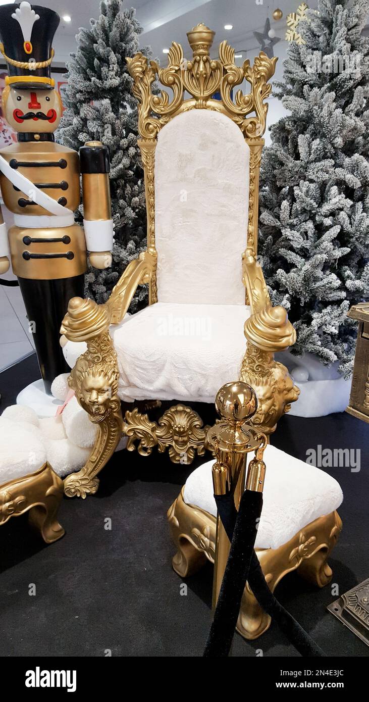 Luxurious golden throne armchair covered with white velvet seat of ...