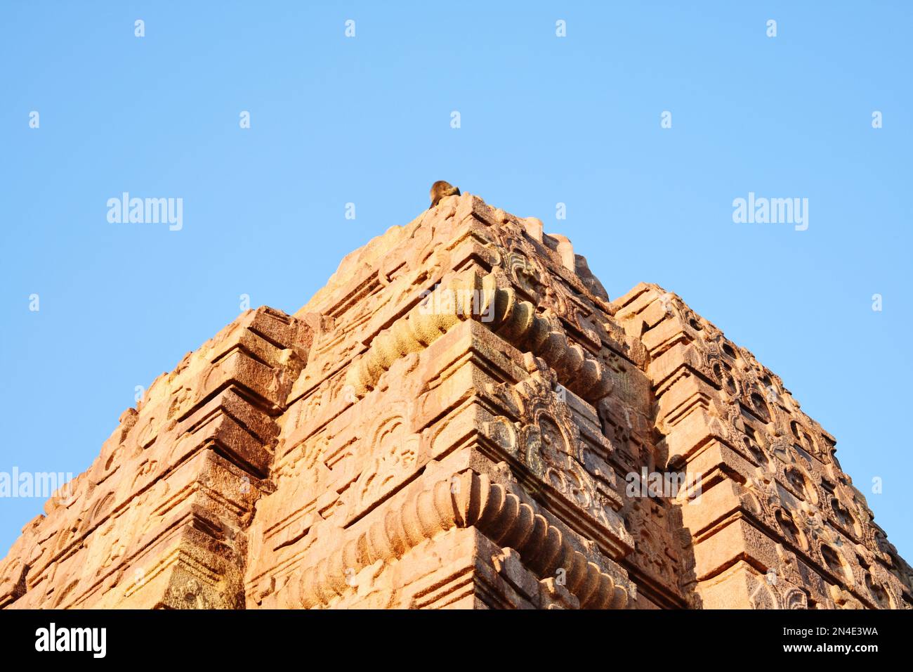 A low angle of the Telika Temple against the bright cloudless sky in ...