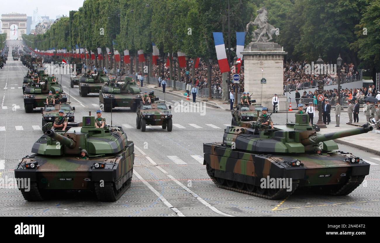 Leclerc tanks drive down the Bastille Day parade on the Champs-Elysees ...