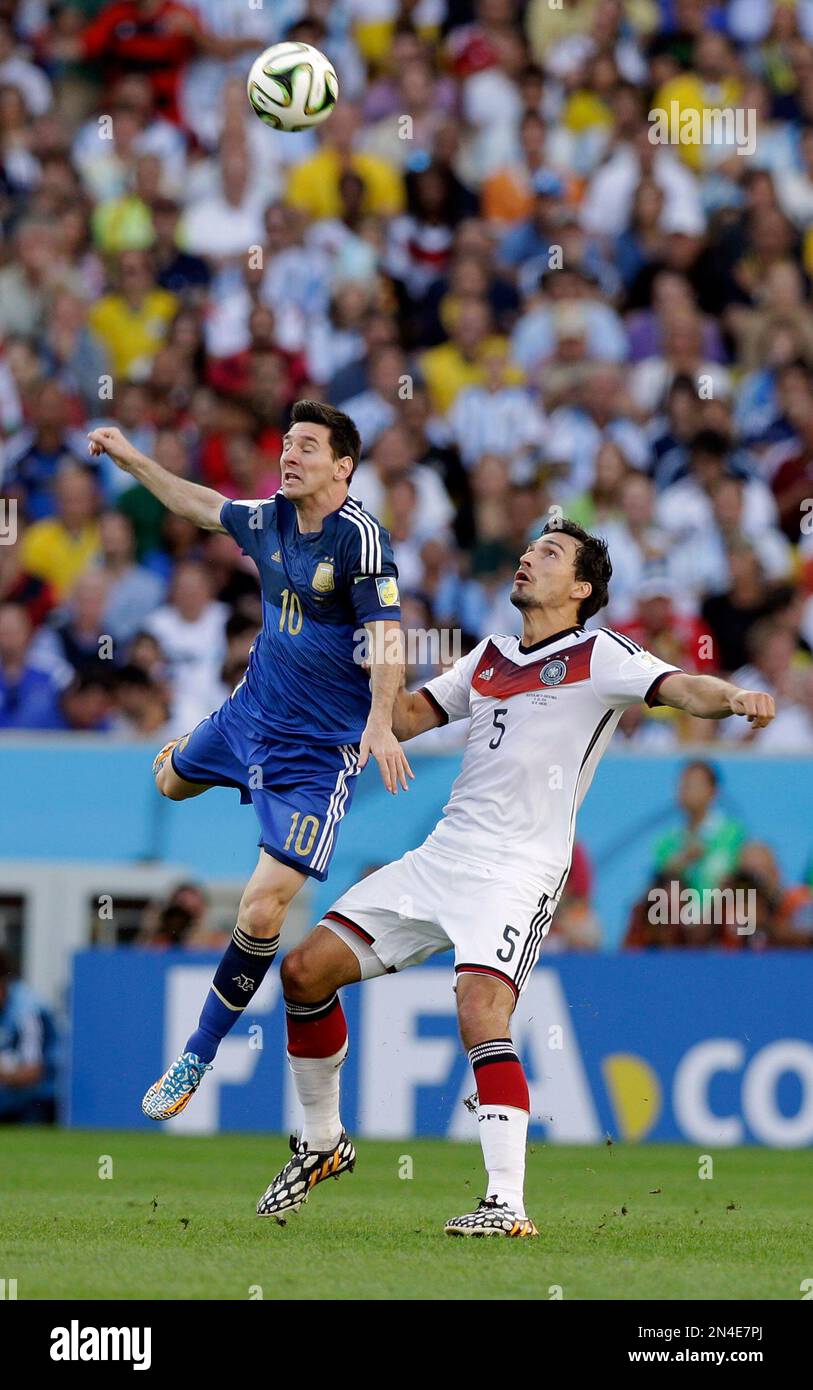 Argentina's Lionel Messi, left, and Germany's Mats Hummels go for an ...