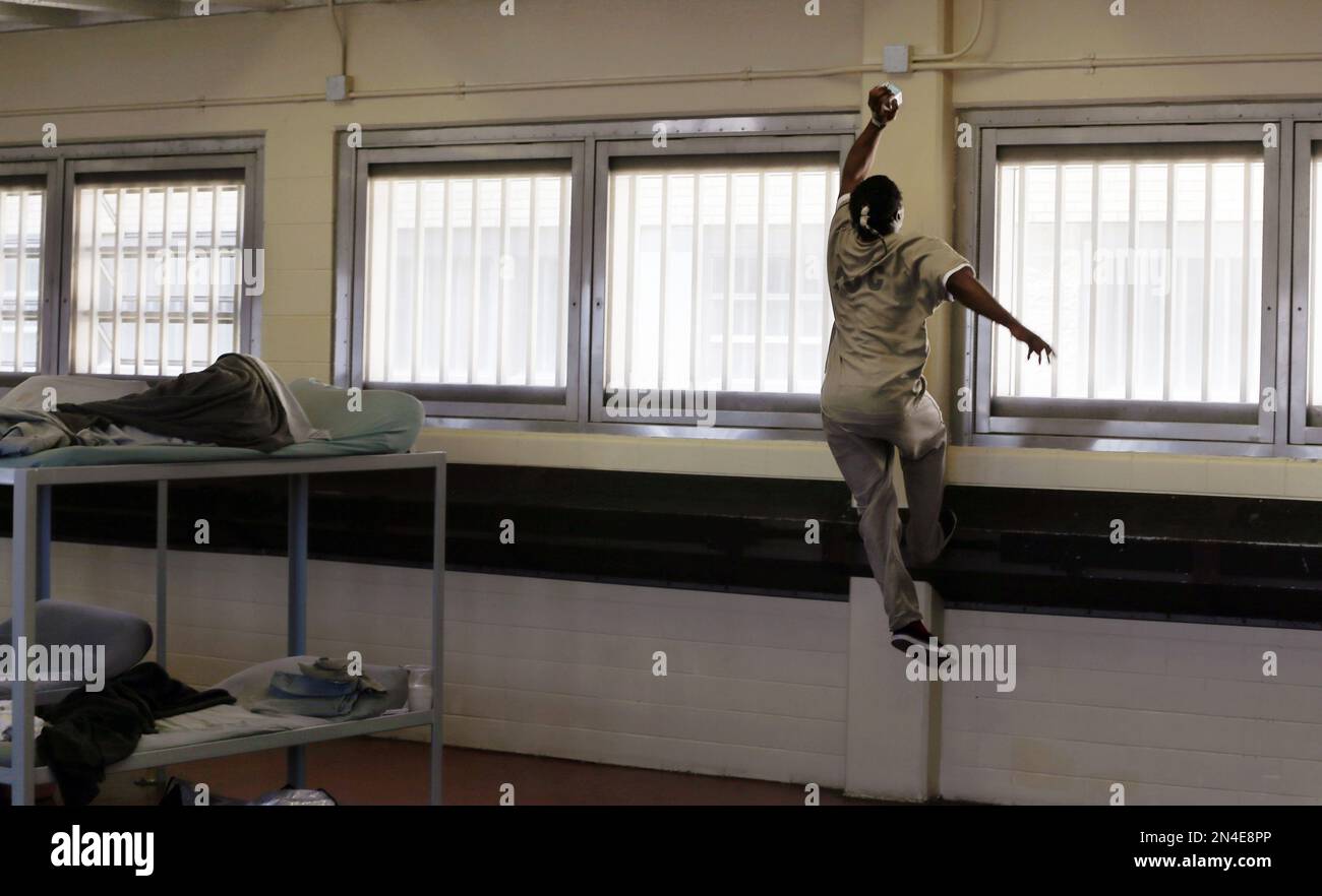 In this June 26, 2014 photo, an inmate, Nick, uses a small milk carton ...