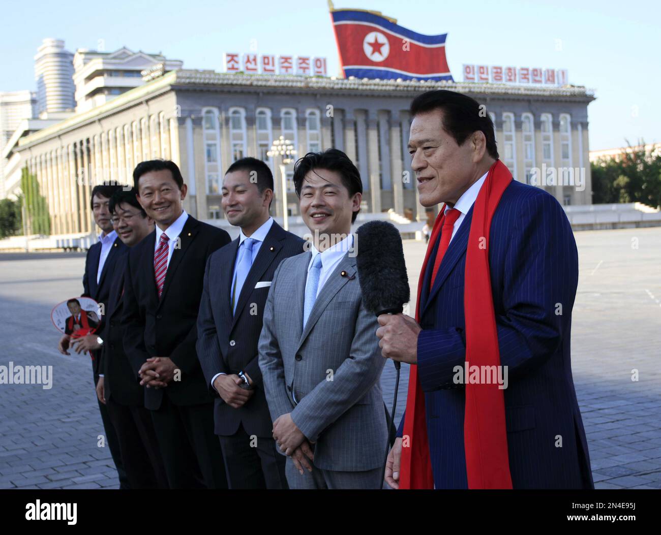 Japanese pro-wrestler turned politician Kanji "Antonio" Inoki, right ...