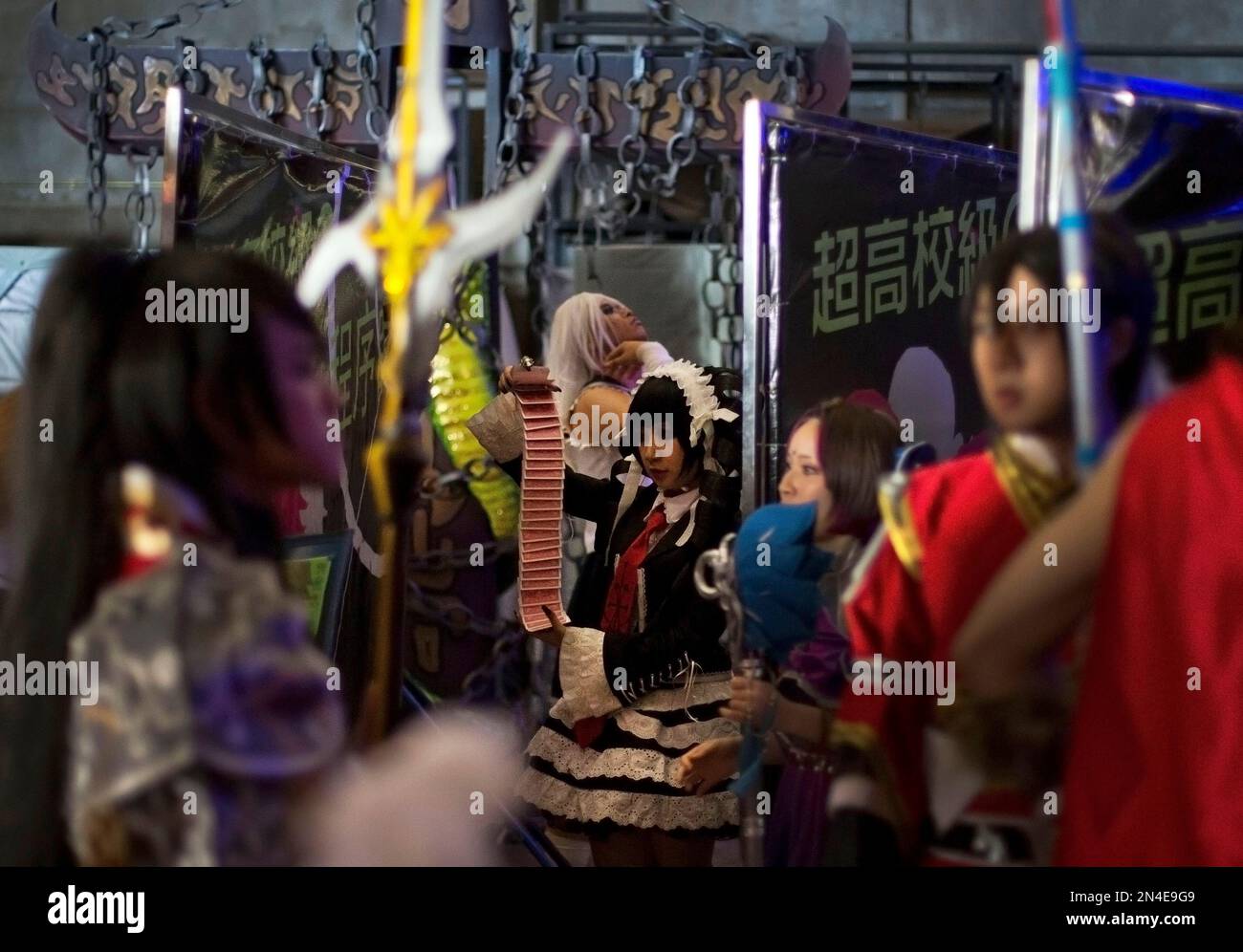 Chinese cosplay enthusiasts dressed as cartoon characters, prepare for ...