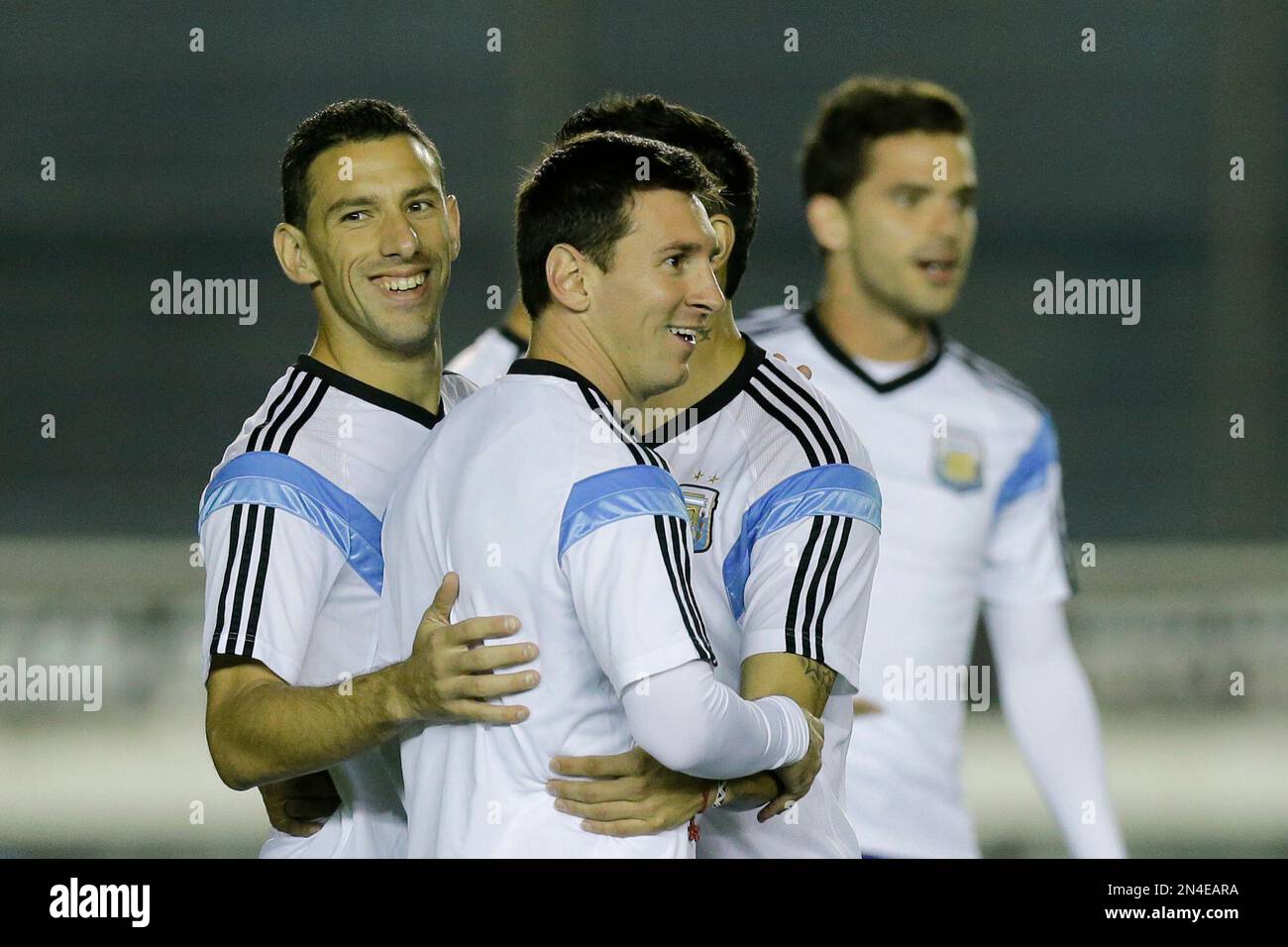 Argentina's Lionel Messi, center, Maxi Rodriguez, left, and Fernando ...