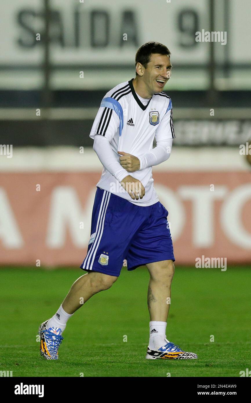 Argentina's Lionel Messi laughs during an official training session at ...