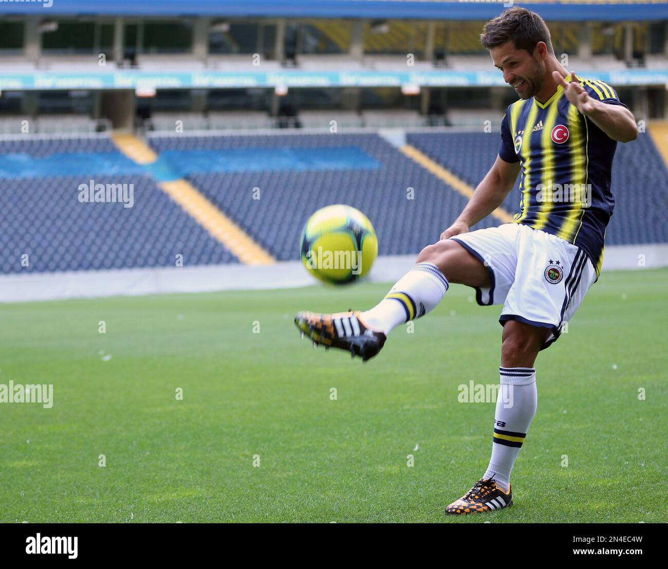 Brazilian soccer star Diego Ribas, left, poses for photographers with ...