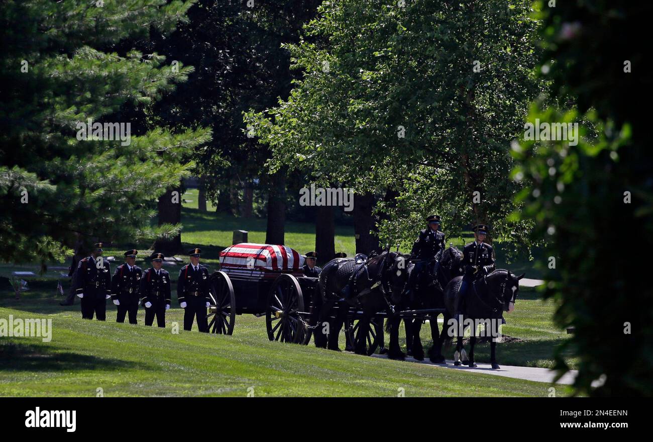 The horse drawn carriage carries the casket of fallen Indianapolis ...