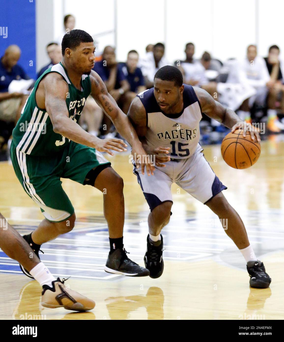 Indiana Pacers' Donald Sloan (15) drives around Boston Celtics' Marcus ...