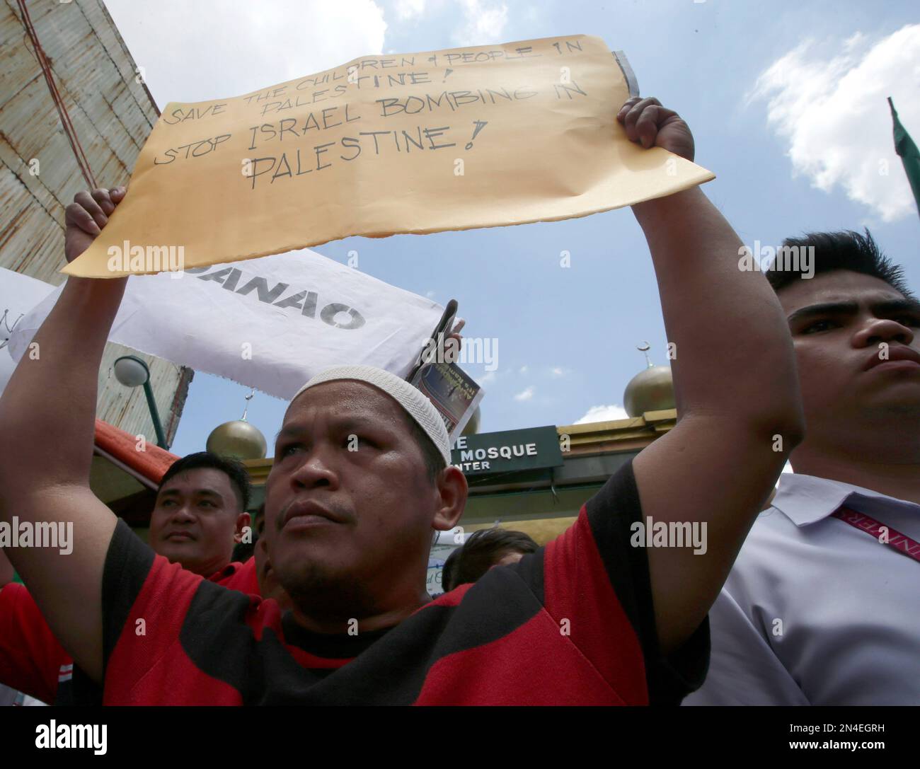 Filipino Muslims display placards during a rally outside the Golden ...