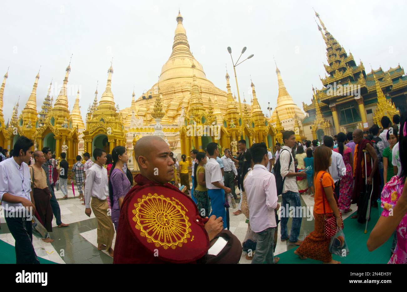 Myanmar Buddhist monk and devotees gather at Shwedagon Pagoda during ...