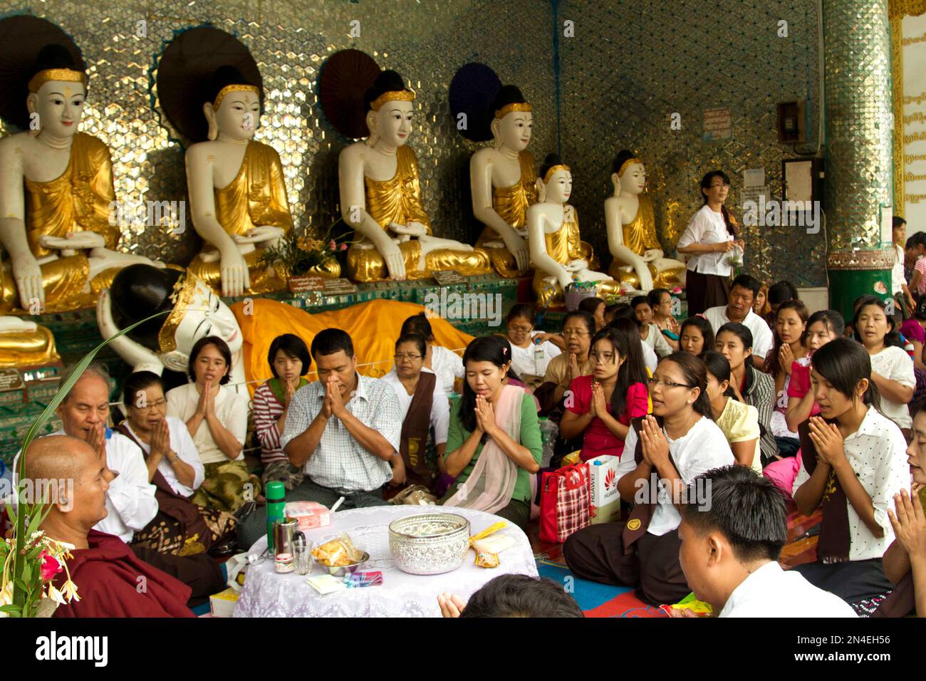 Myanmar Buddhist offer prayers during the full moon day of Waso, the ...