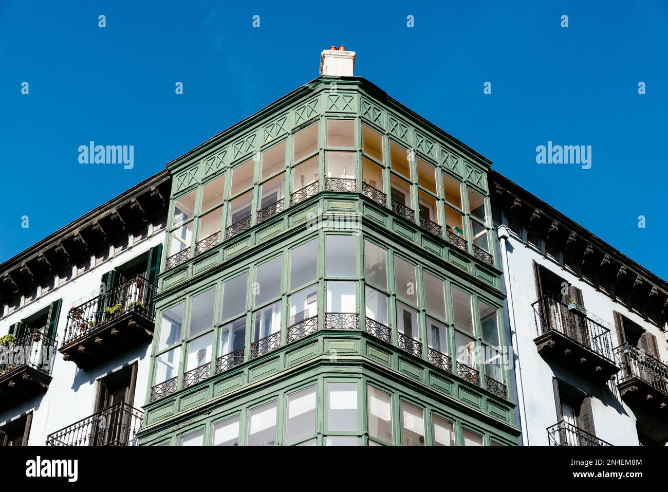 Traditional green painted bay windows in the old town of Bilbao, Basque ...