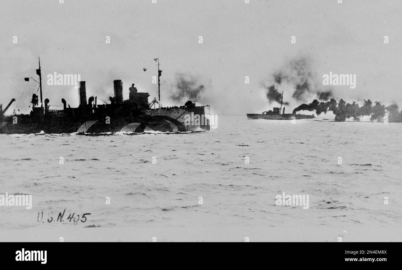 The USS Vampire, right, spews out a smoke screen as the USS Shawmut ...