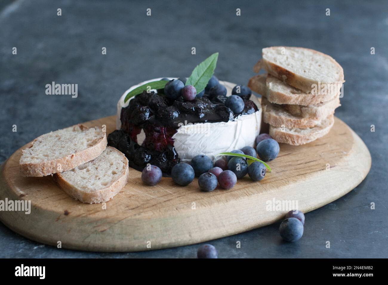 This June 30, 2014 photo shows a blueberry topping over brie in Concord ...