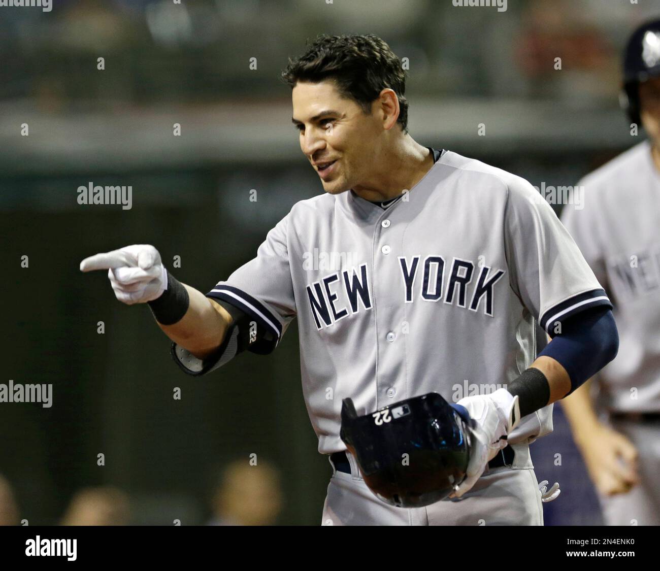 New York Yankees' Jacoby Ellsbury points into the dugout and smiles ...