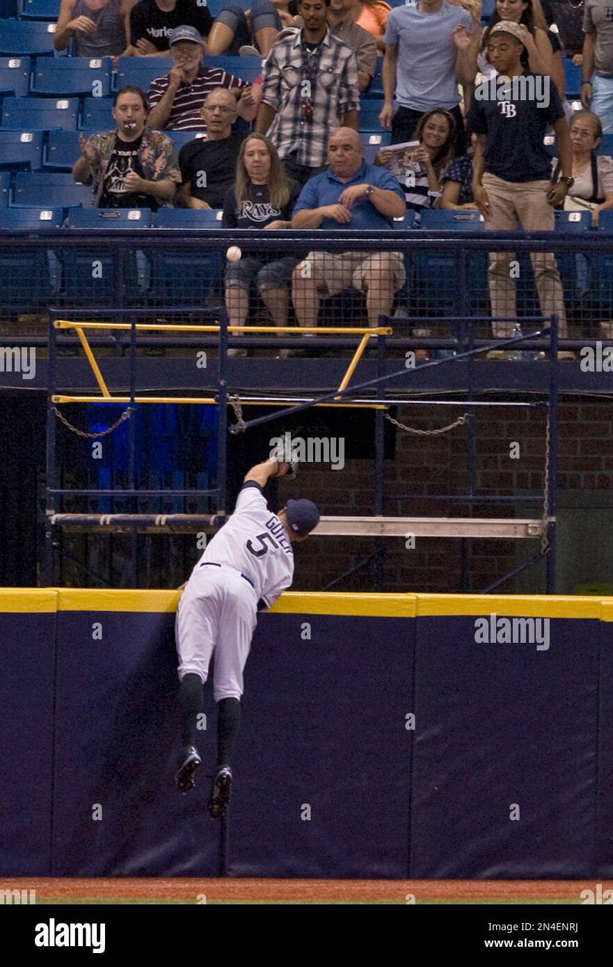 Tampa Bay Rays left fielder Brandon Guyer (5) comes up short going ...