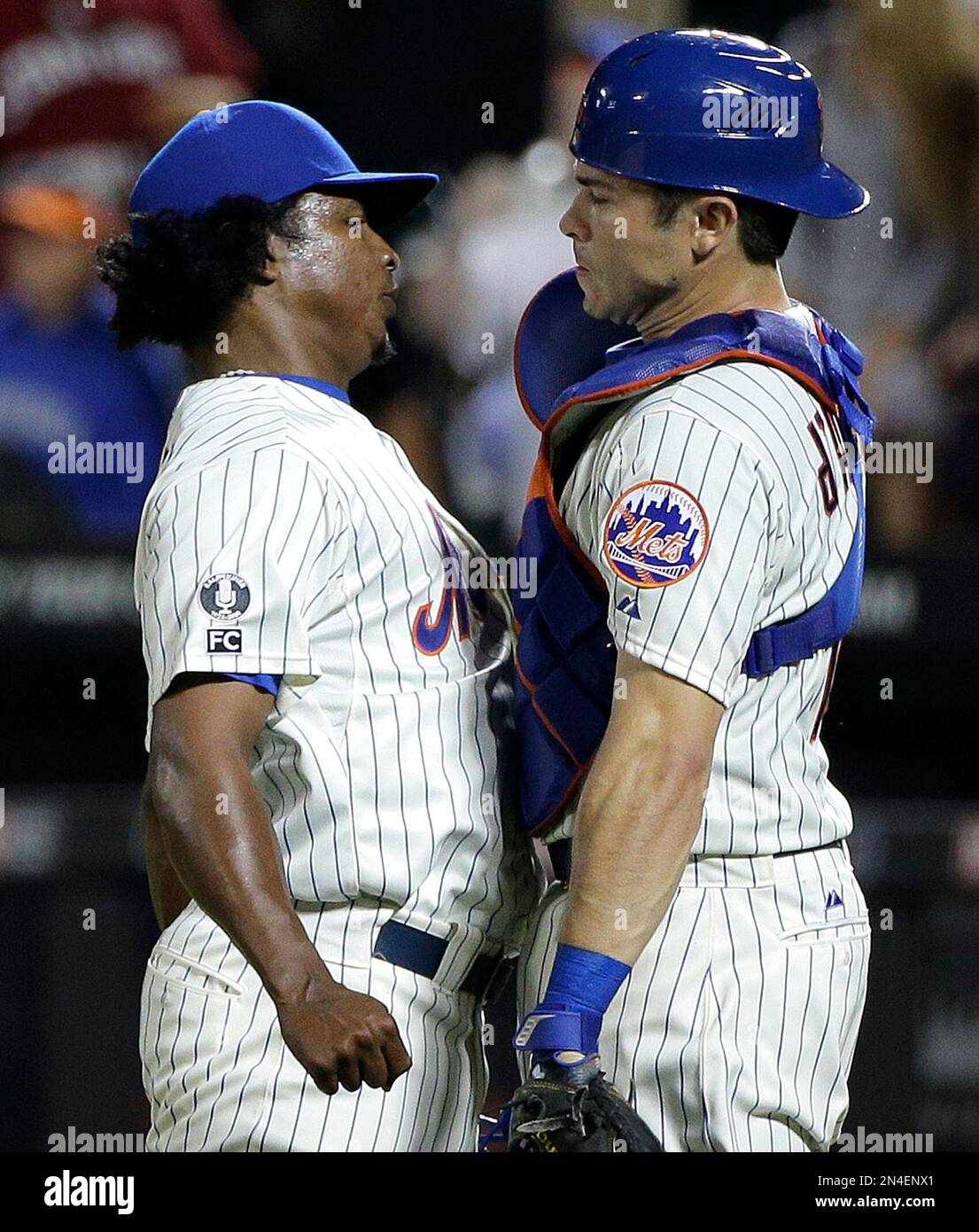 New York Mets pitcher Jenrry Mejia, left, bumps chests with catcher ...