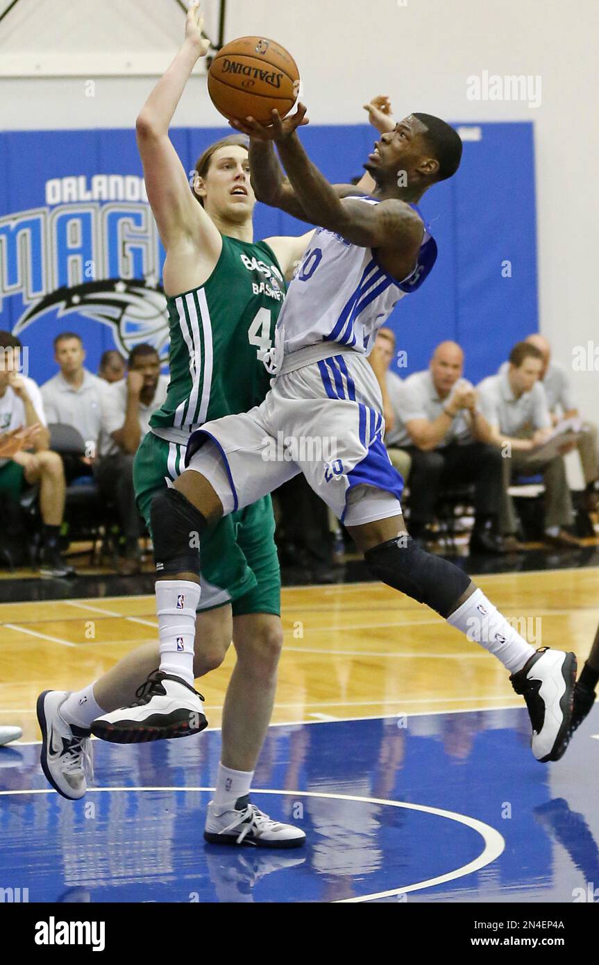 Detroit Pistons' DeAndree Liggens, right, goes up for a shot against ...