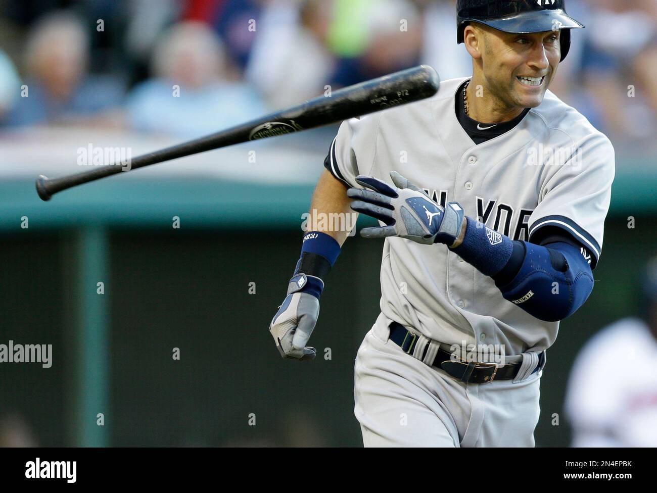 New York Yankees' Derek Jeter throws his bat and reacts after lining ...