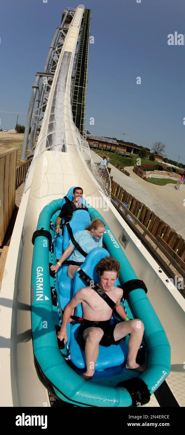 In this photo taken with a fisheye lens, riders go down the world's ...