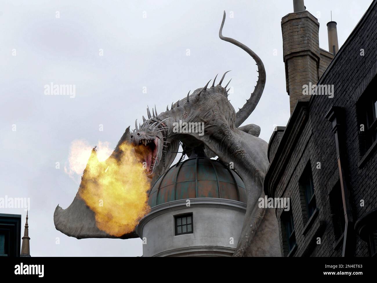 This June 19, 2014 file photo shows a dragon breathing fire from atop ...